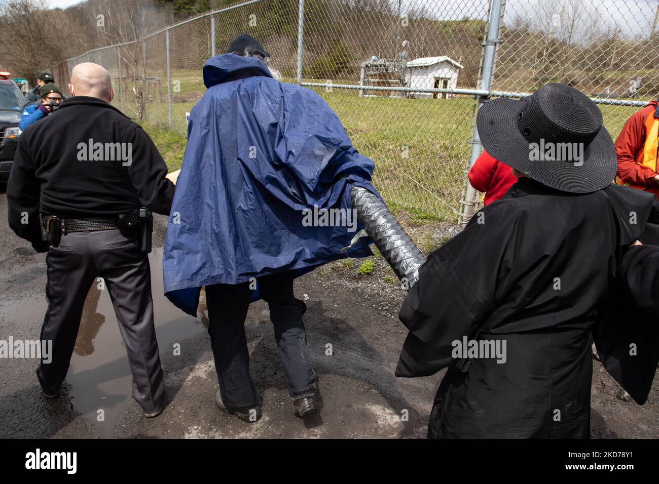 Police arrest climate activists blocking the entrance to the Grant Town ...