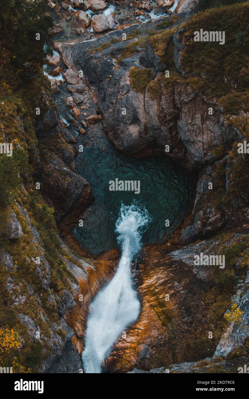 A vertical top view shot of the mesmerizing Poellat Gorge waterfall in ...