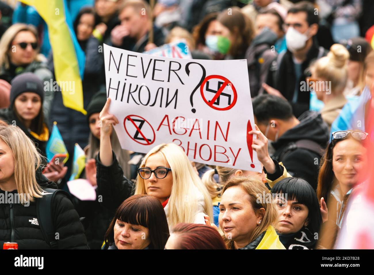 a sign of "never Nazi sign" is seen during the antiwar protest in Bonn ...