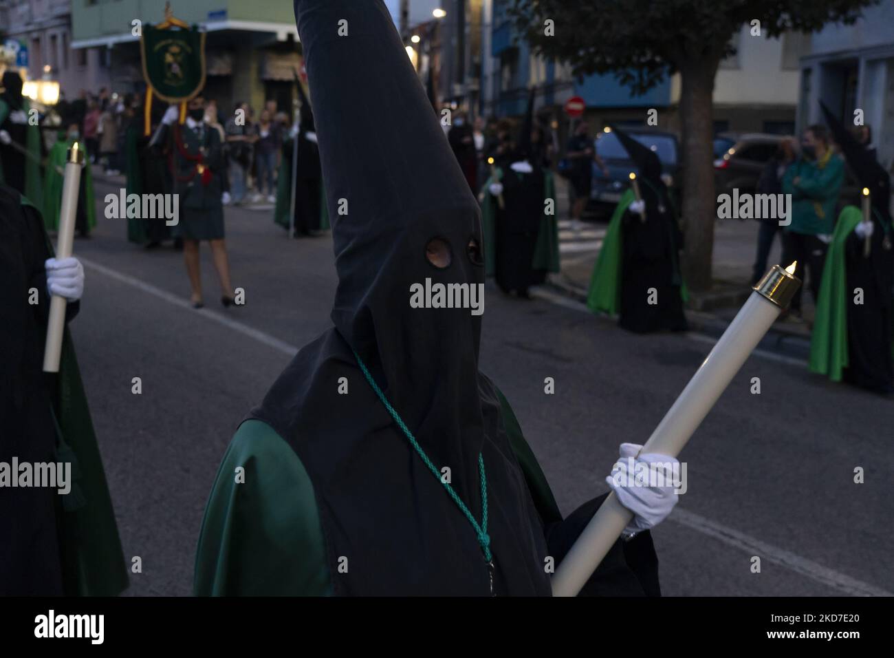 Some brothers carry candles during the procession of hope that runs ...