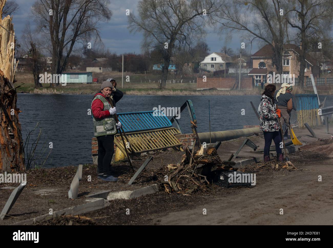 Lockal inhabitants clean the streets of Borodyanka from the rubbles ...