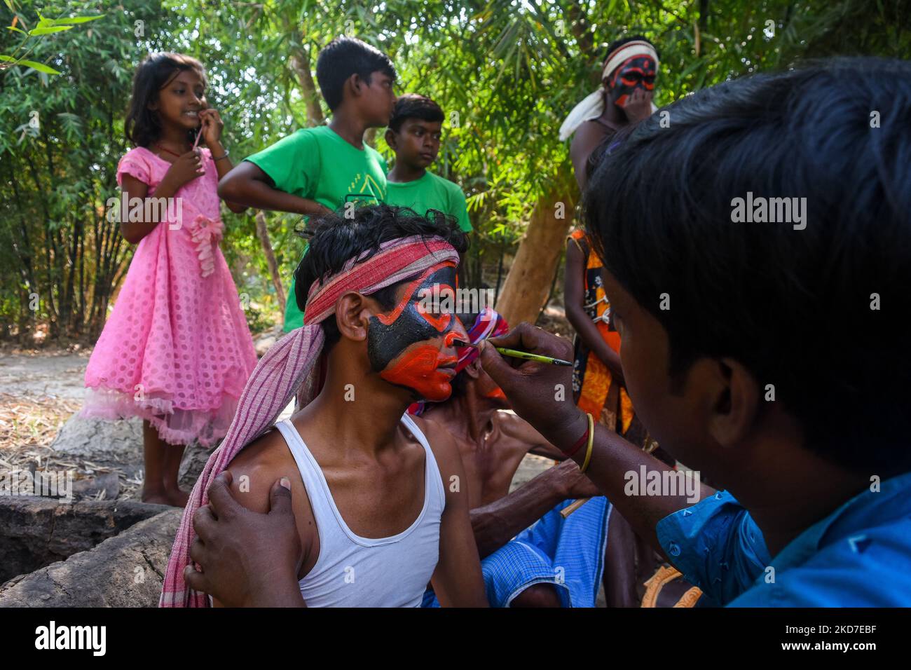 A devotee is seen drawing various colored art on ones face , ahead of ...