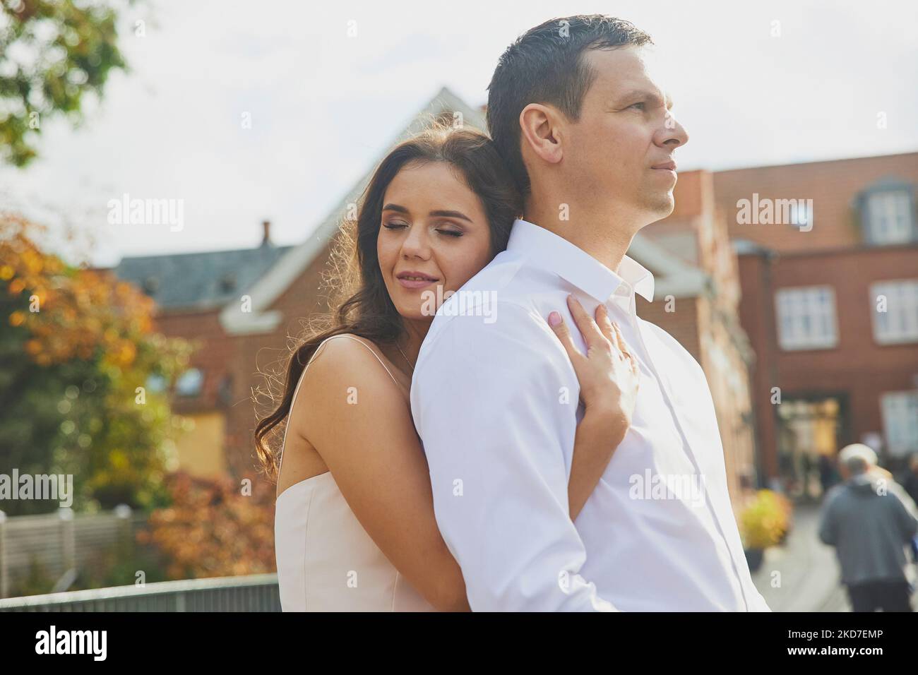 Ribe, Denmark, October, 2022: couple in love hugging in autumn city ...