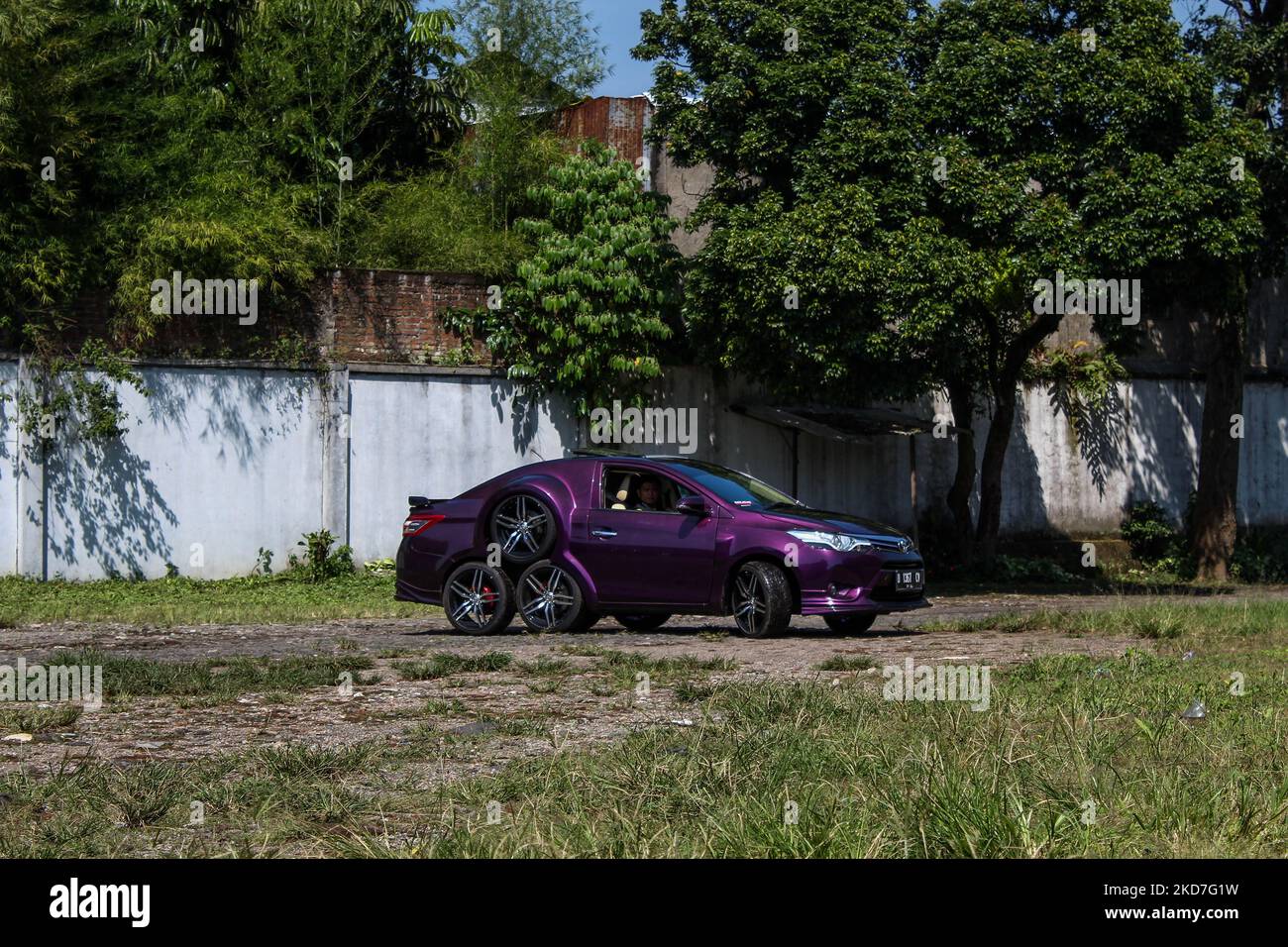 A man drives a modified car on April 13, 2022 at Gemah Ripah Taxi Pool ...