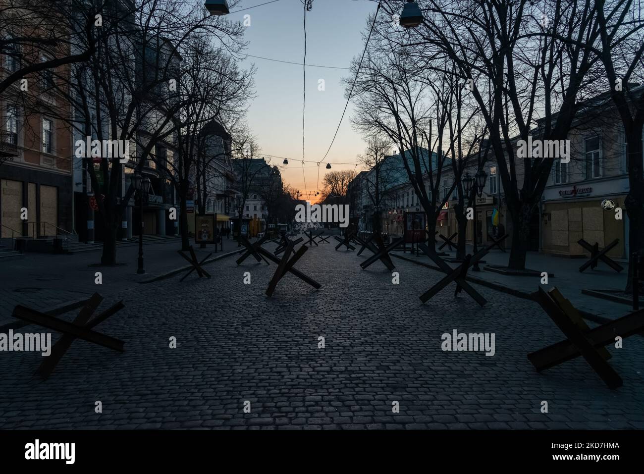 Iron structures are seen at sunset placed on the street in the city ...