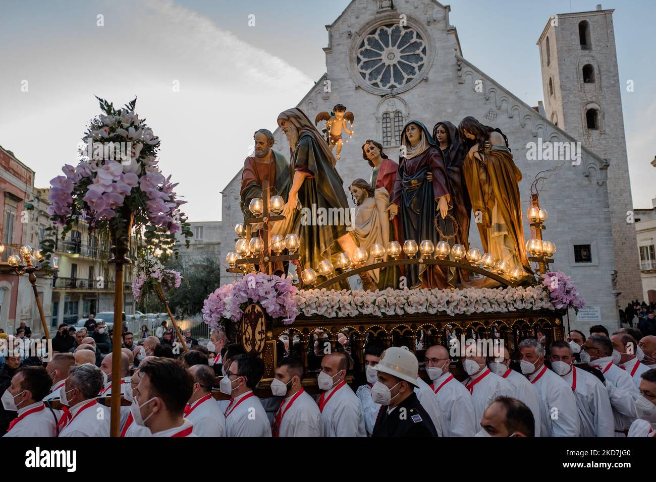 The bearers carry the statue of the Eight Saints on their shoulders, on ...