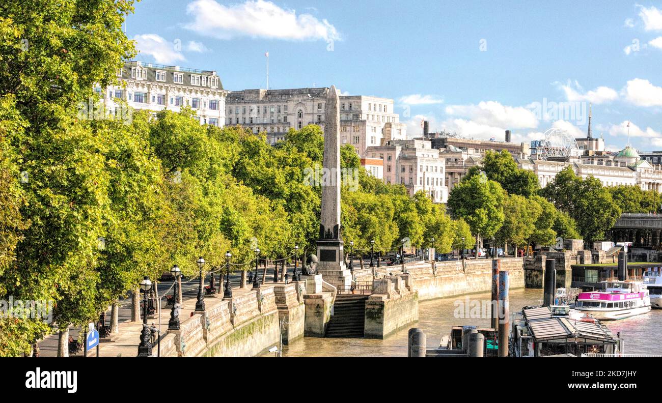 A beautiful view of the Cleopatra's Needle with traditional buildings ...