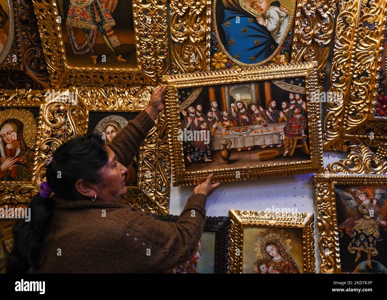 Lucila Cruz Juchasara from Artesanías Nuestro ARTE Cusqueño hangs a ...