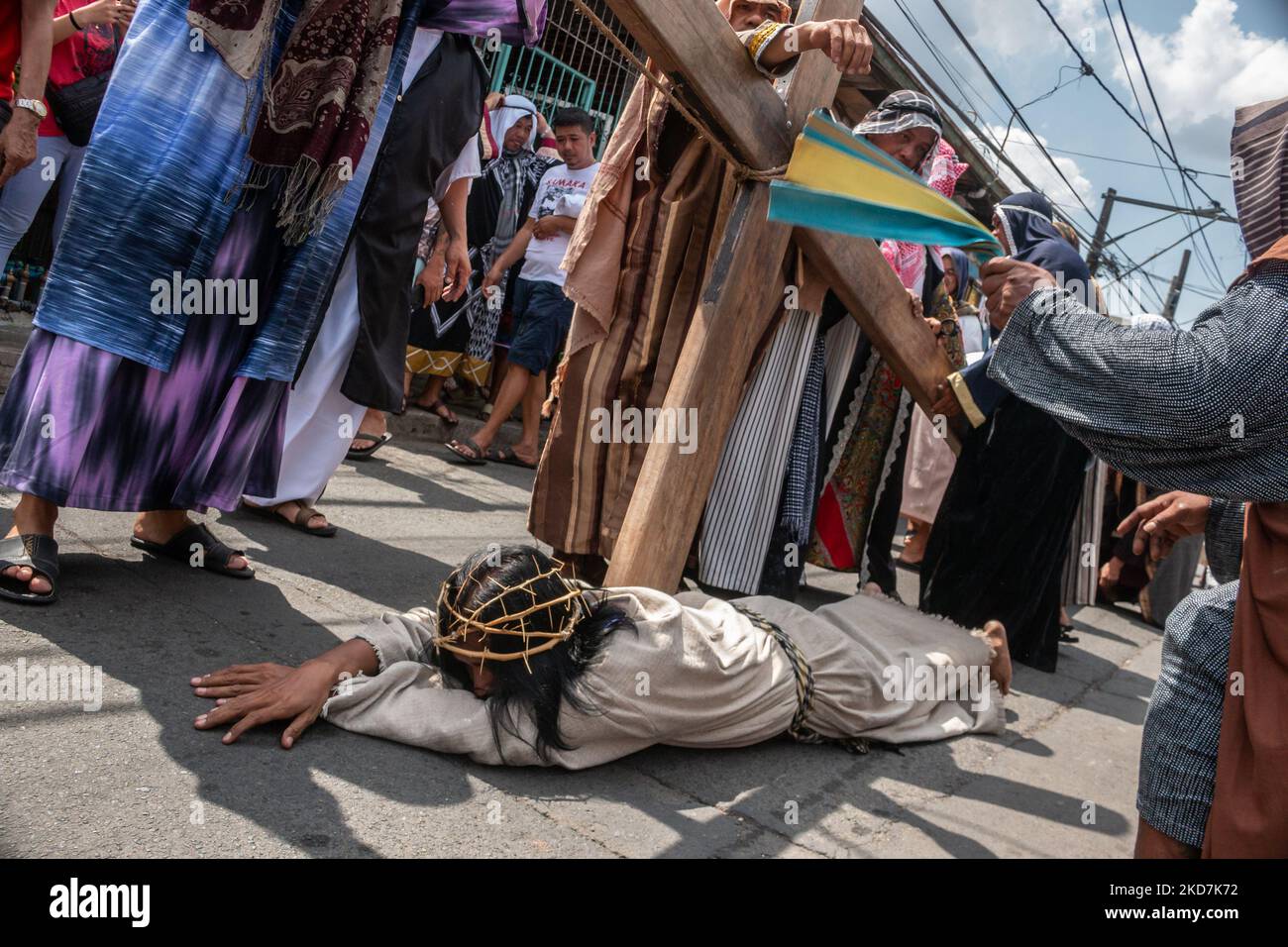 A man reenacts Jesus' carrying the cross on Good Friday in Antipolo ...