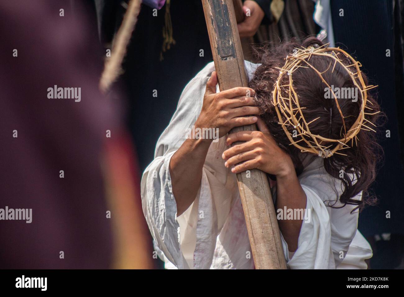 A man reenacts Jesus' carrying the cross on Good Friday in Antipolo ...