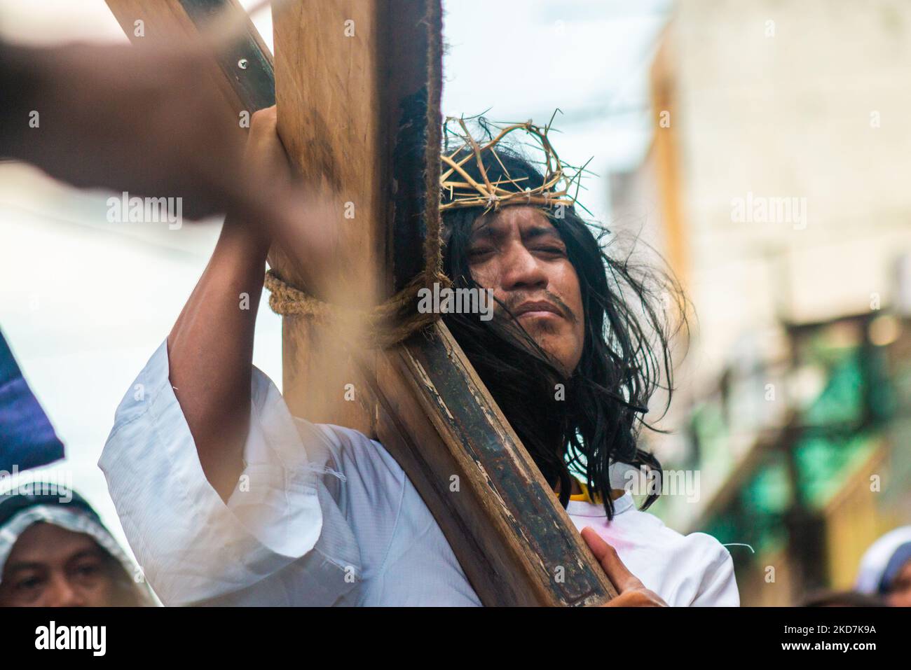 A man reenacts Jesus' carrying the cross on Good Friday in Antipolo ...
