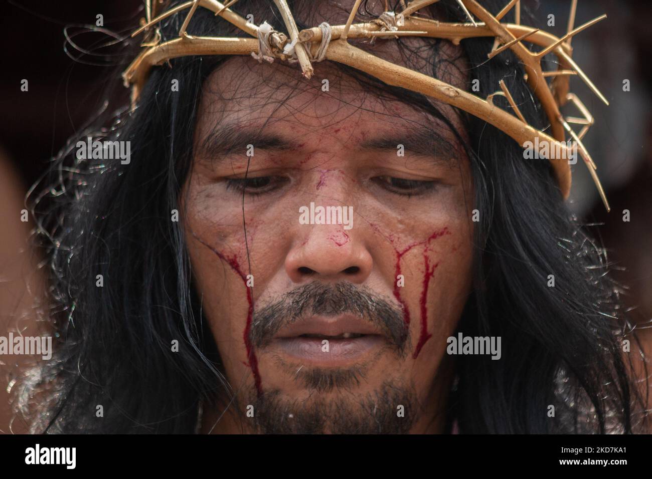 A man reenacts Jesus' carrying the cross on Good Friday in Antipolo ...