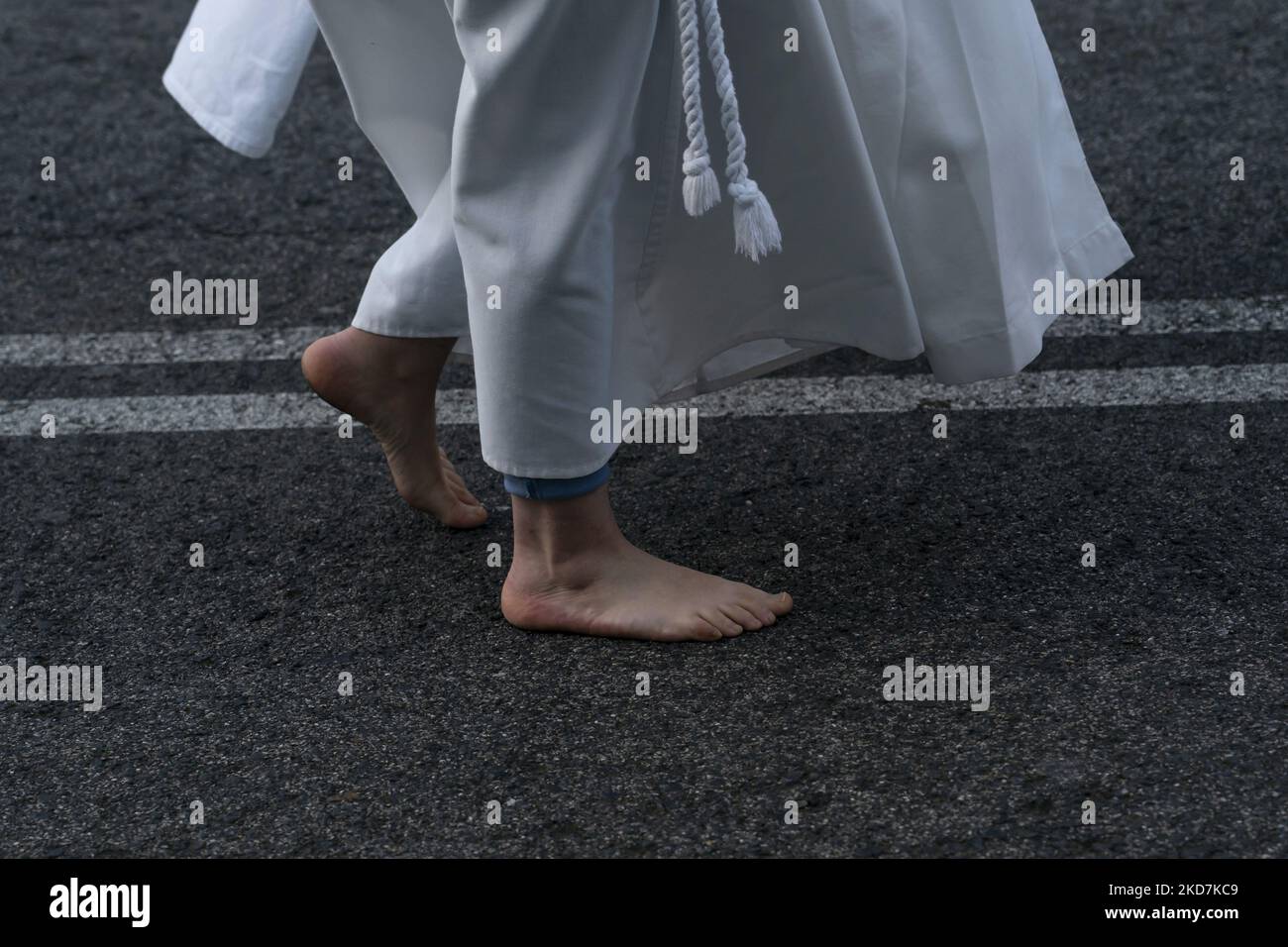 Some of the brothers go barefoot in the Holy Thursday procession in ...