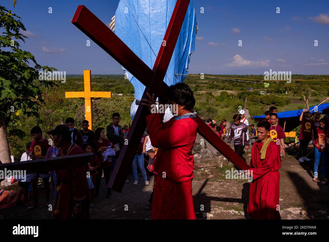 Catholic devotees visit a hill with giant images of the Holy Trinity in ...