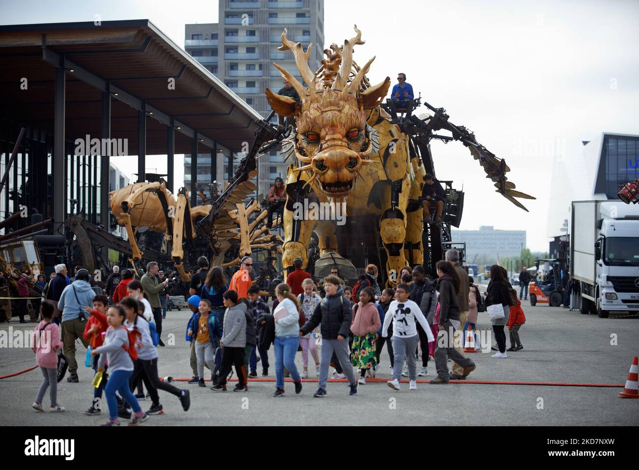 Children walk in front of Long-Ma during the rehearsal. A robot, a mare ...