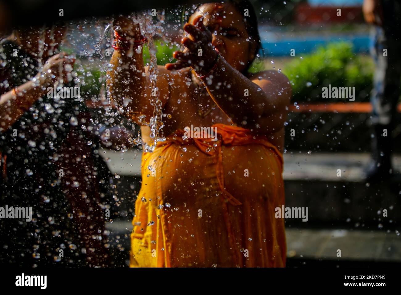 Nepalese devotees take holy baths from 22 stone spouts during Baisdhara ...