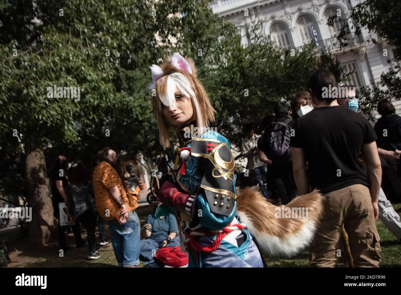 Cosplayers dressed as their favourite characters stand for a photo ...
