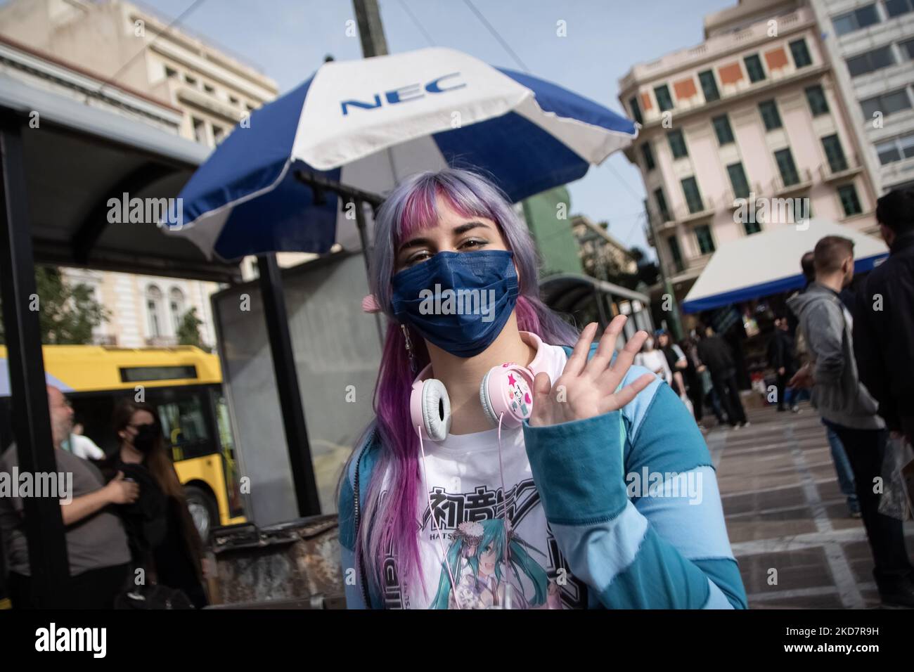 Cosplayers dressed as their favourite characters stand for a photo ...