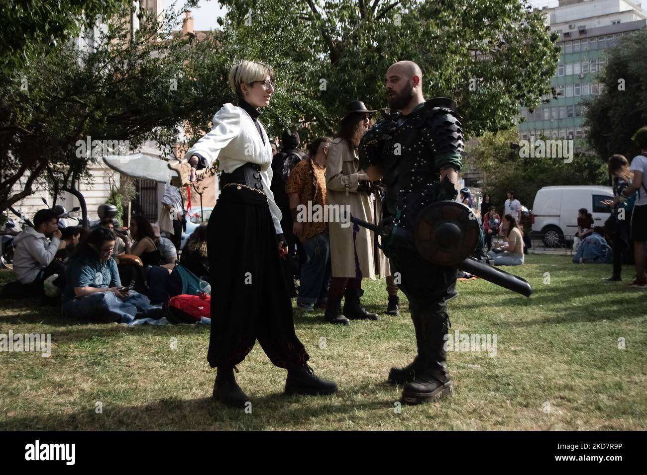 Cosplayers dressed as their favourite characters stand for a photo ...