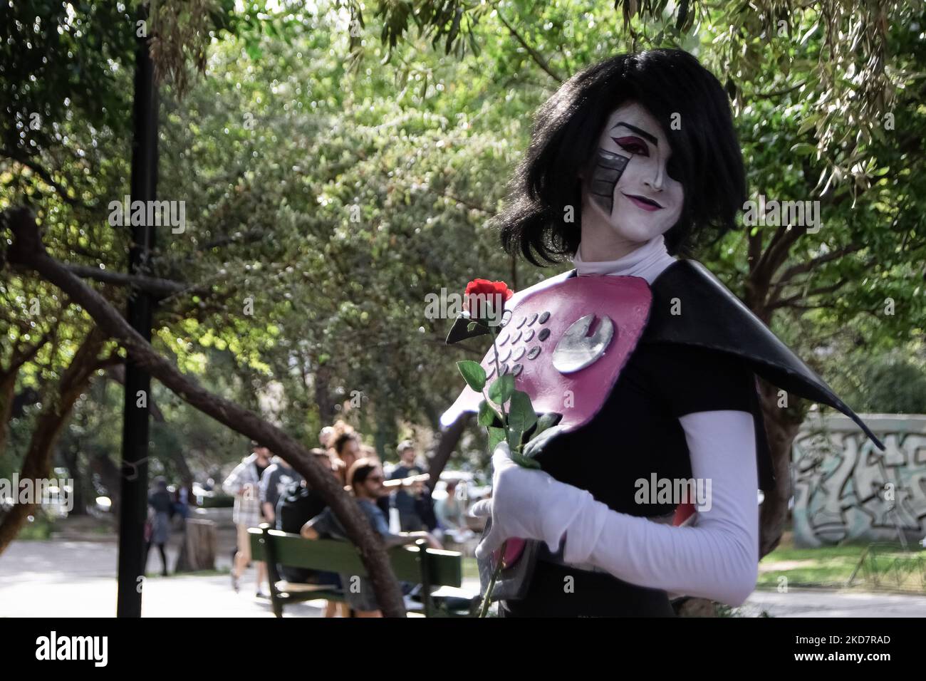 Cosplayers dressed as their favourite characters stand for a photo ...