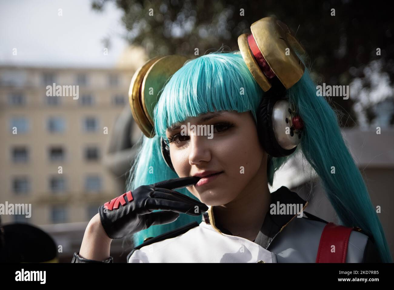 Cosplayers dressed as their favourite characters stand for a photo ...