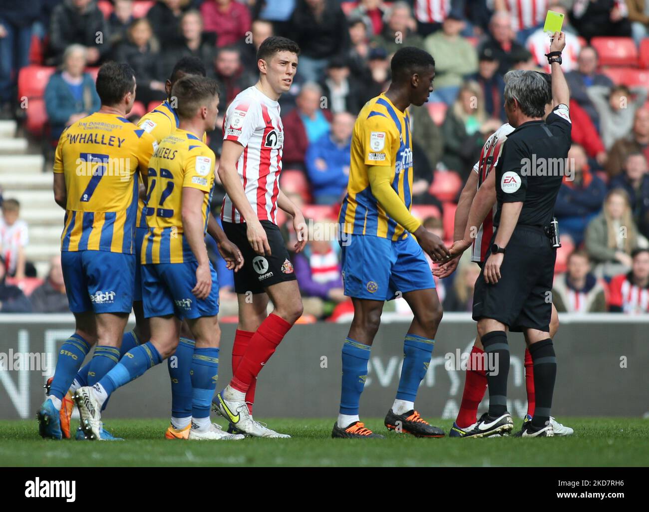 Sunderland's Ross Stewart is booked for simulation by Referee Darren ...