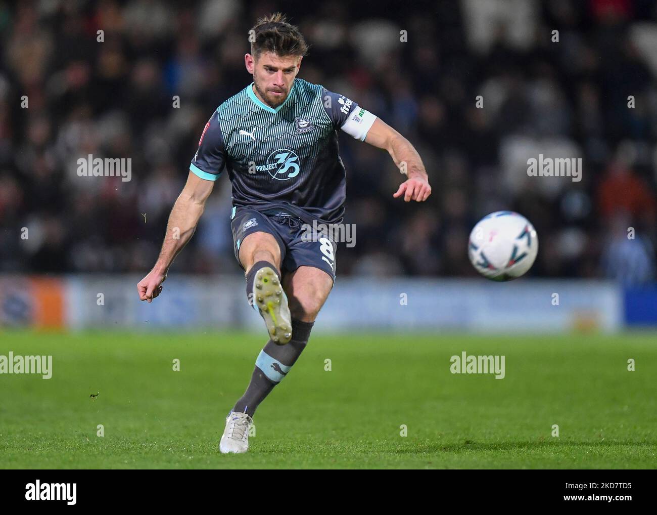 Plymouth Argyle midfielder Joe Edwards (8) crosses the ball during the ...