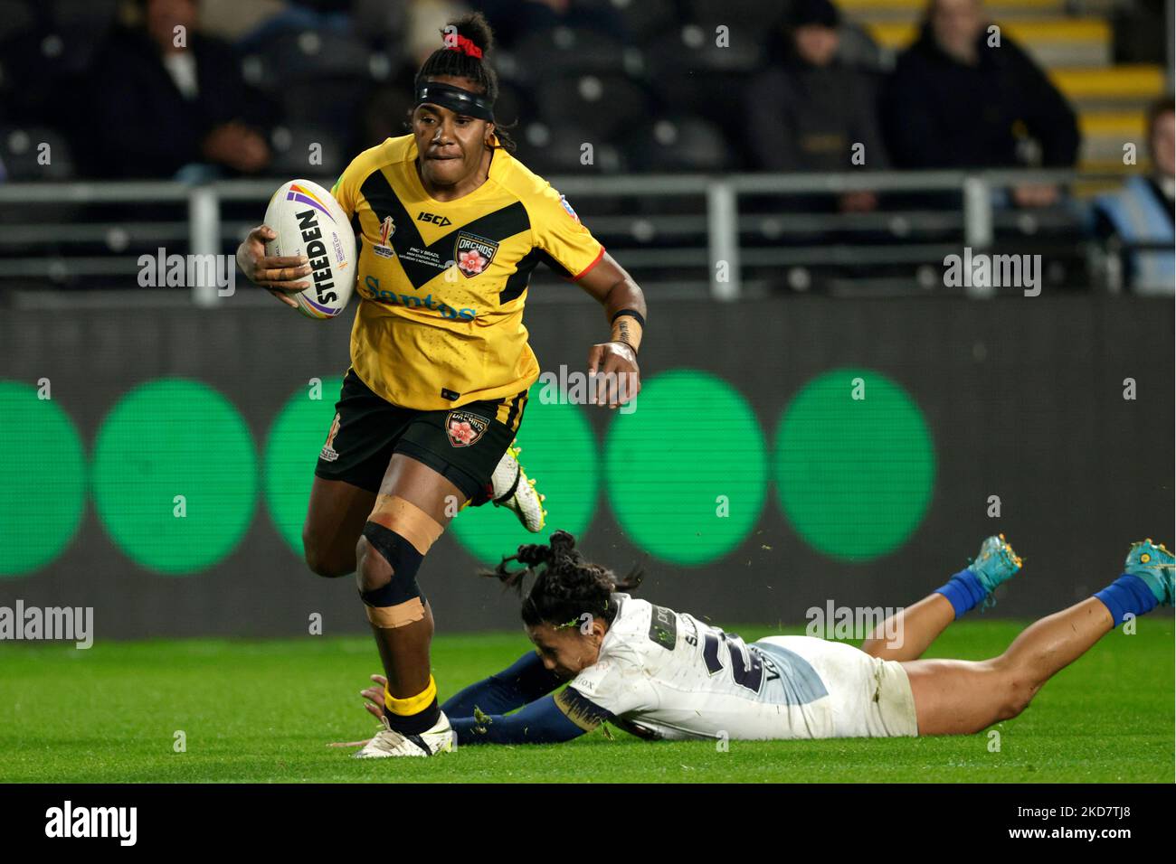 Papua New Guinea's Belinda Gwasamun breaks free to score a try during the Women's Rugby League ...