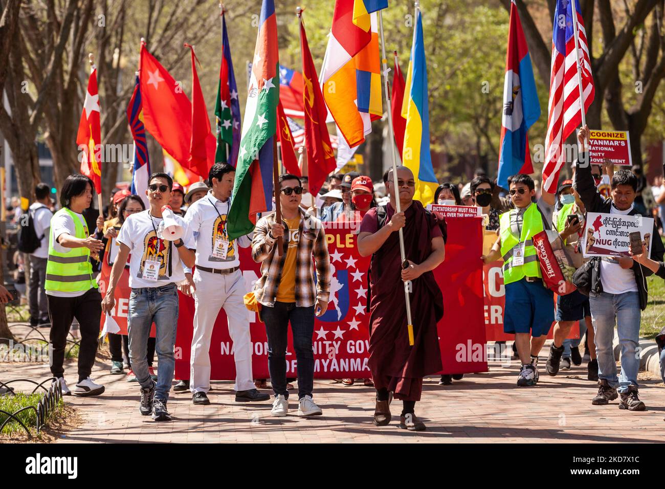 A Buddhist monk leads the march during a multi-ethnic demonstration ...