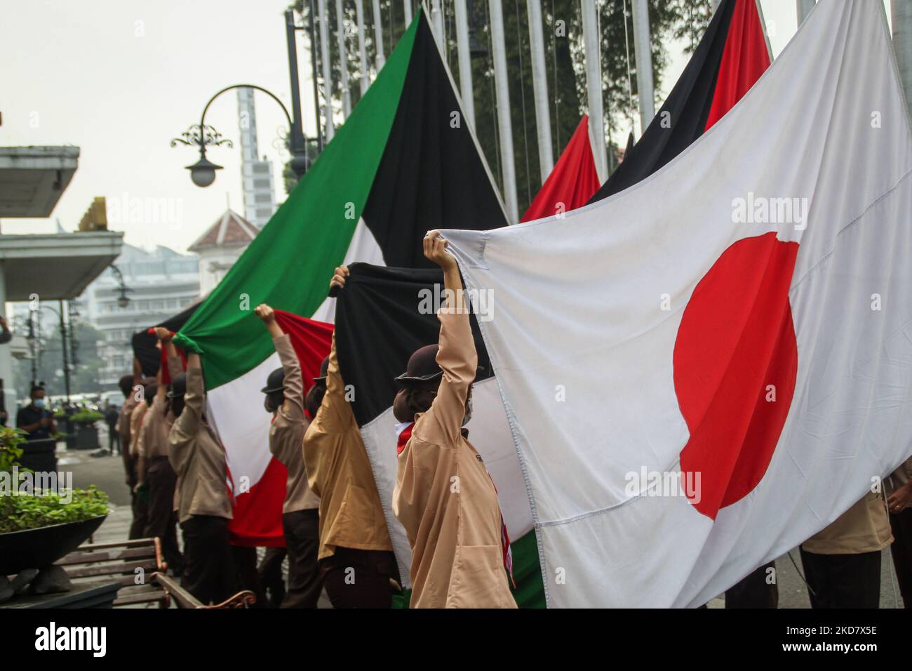 Scout members raise the flag of the Asian-African conference members on ...