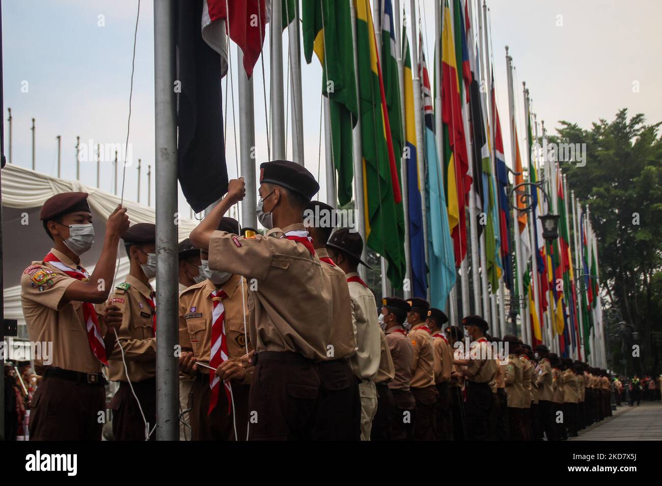 Scout members raise the flag of the Asian-African conference members on ...
