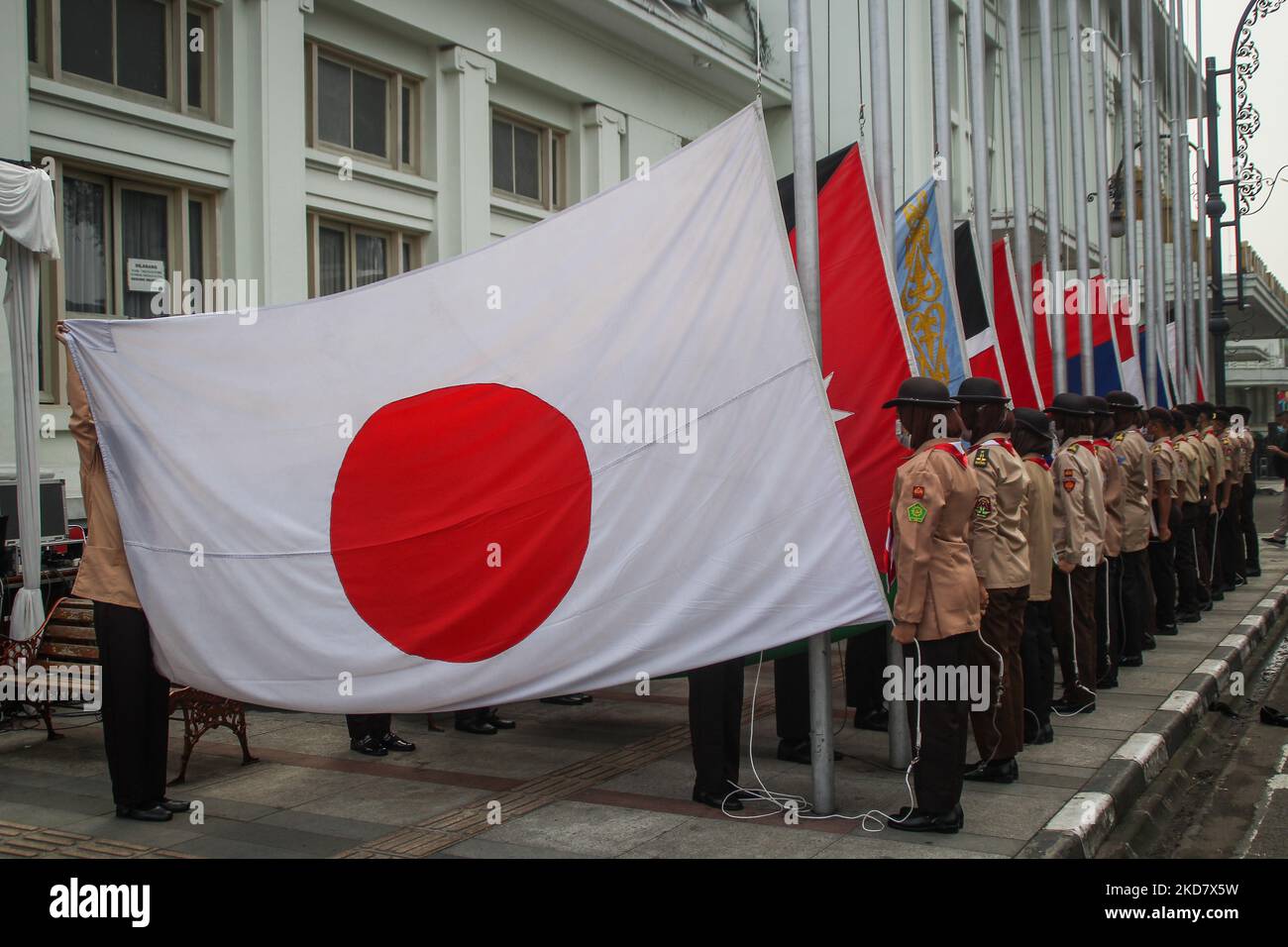 Scout members raise the flag of the Asian-African conference members on ...
