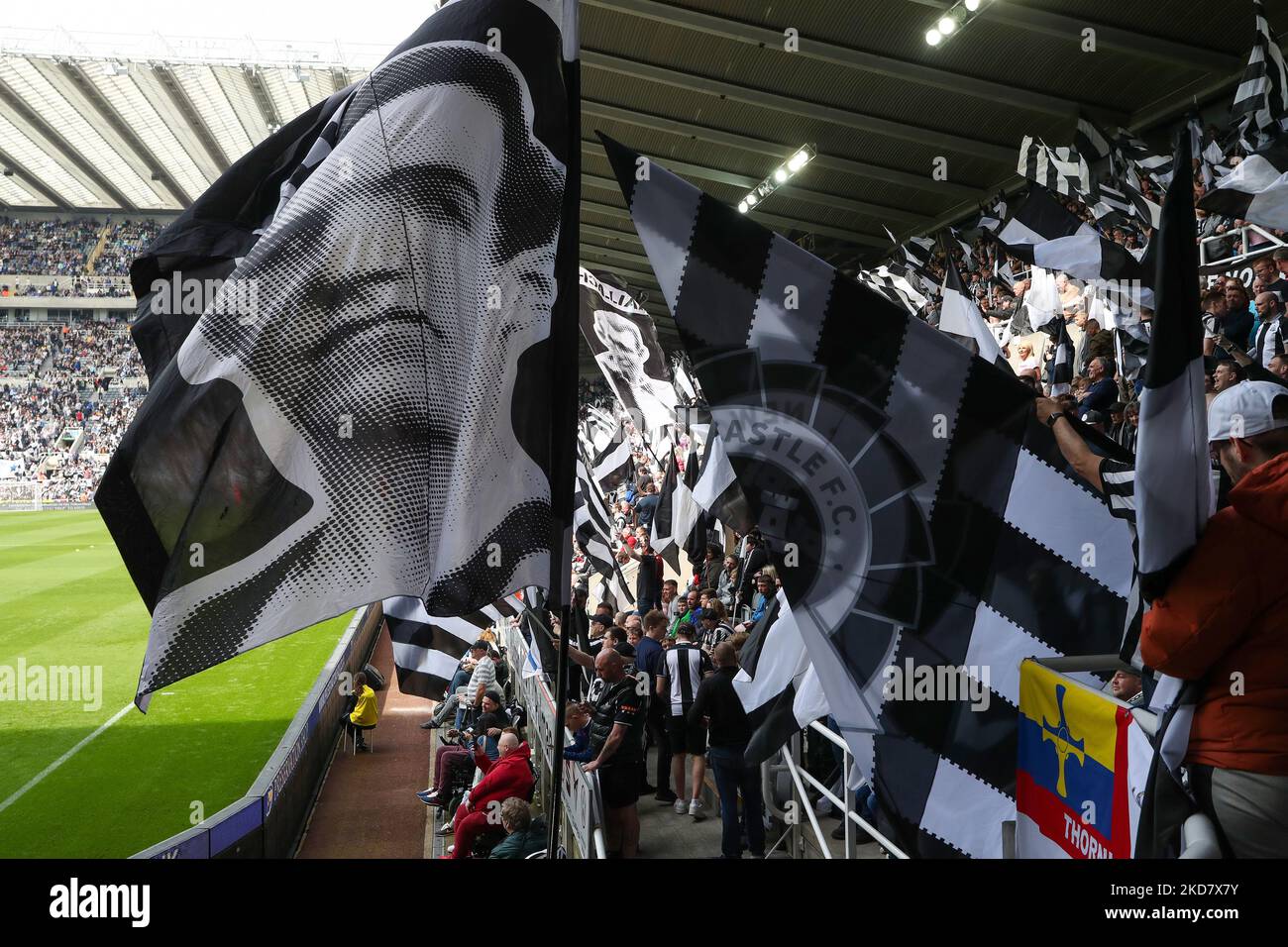 Newcastle United's fans wave flags provided by supporters group "Wor ...
