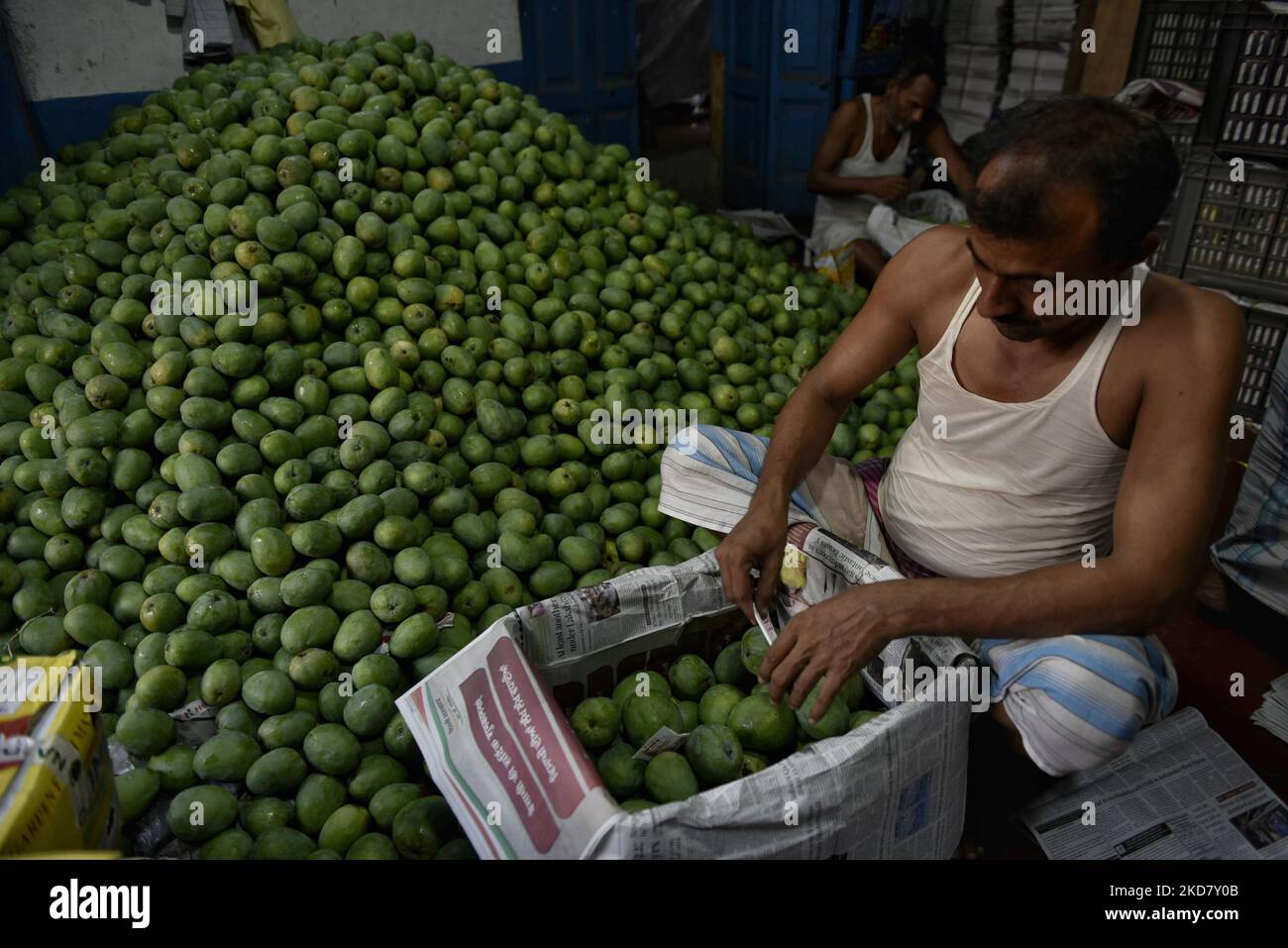 Labours work inside Mango wholesale market shop in Kolkata, India, 18 ...