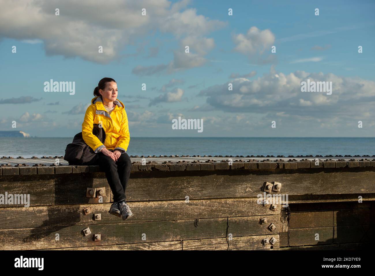 Sad girl sitting sea hi-res stock photography and images - Alamy