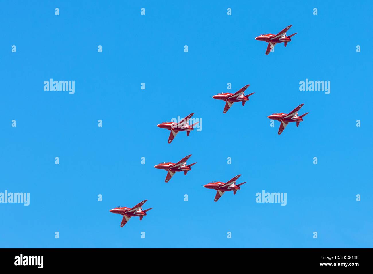 A view of red airplanes during flight in background of sky Stock Photo ...