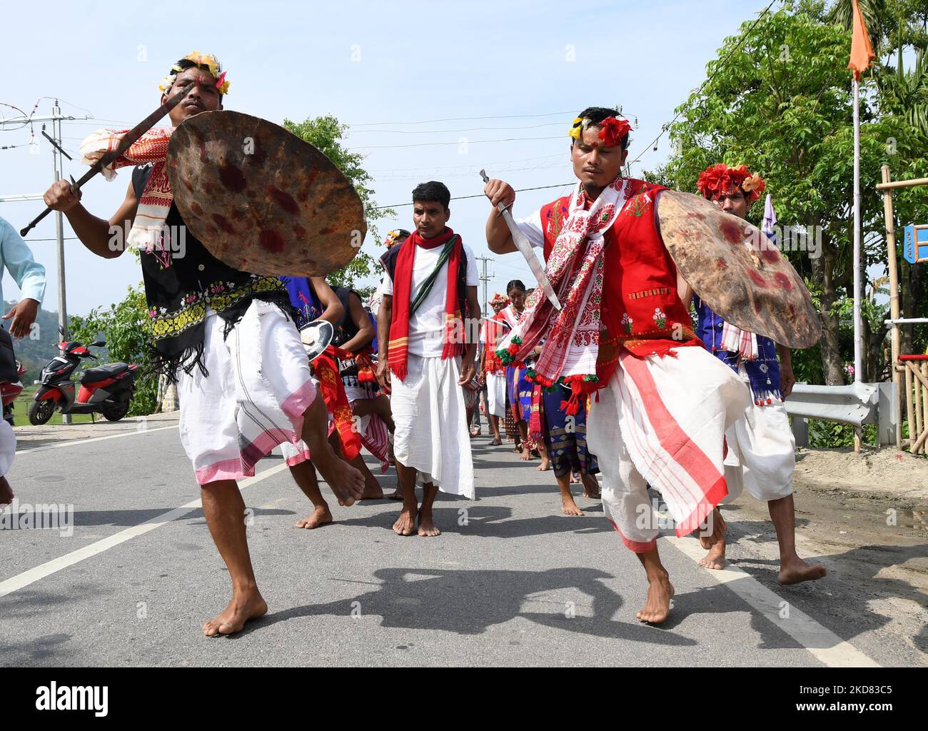 Karbi tribe in traditional attire perform a warrior dance as they take ...