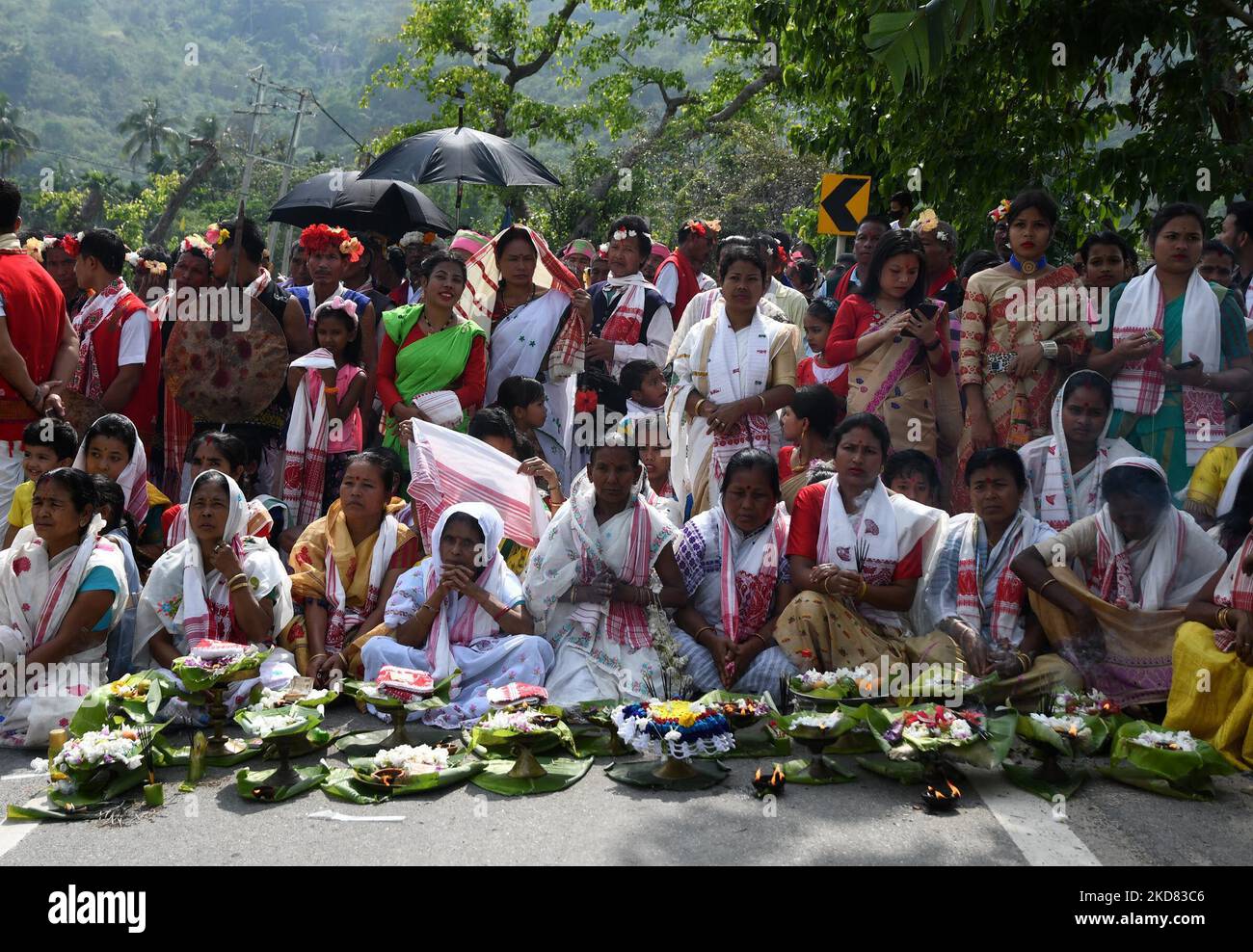 Villagers receive blessings during a religious procession to mark the ...