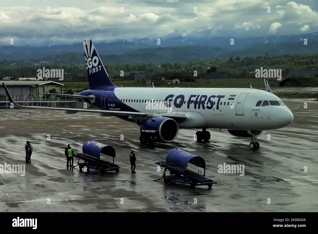 Ground staff near a Go First Previously known as GoAir Commercial ...