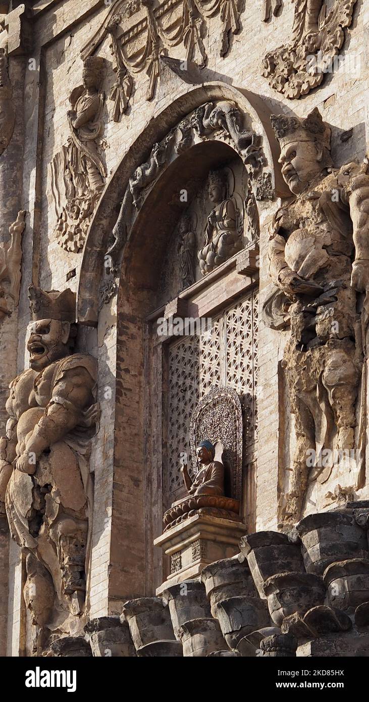 A vertical shot of Chinese temple architecture in sunlight with ...