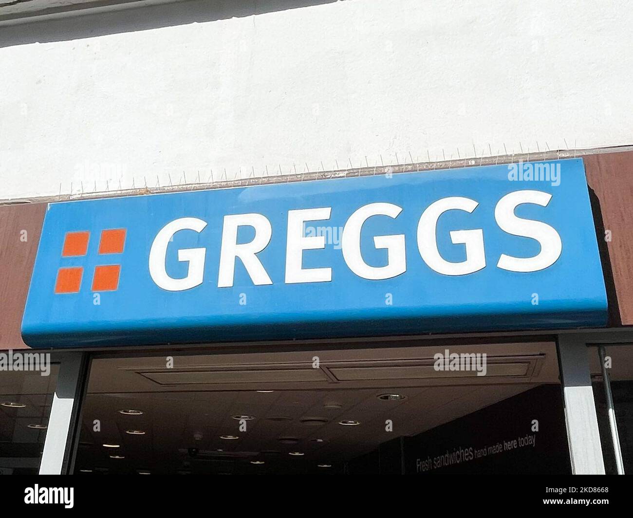A Greggs logo is seen in London 22 April 2022. (Photo by Giannis ...