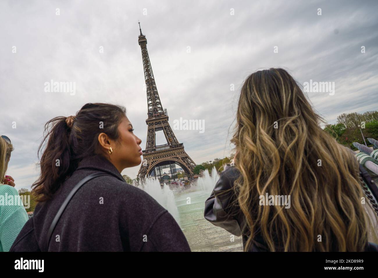 Tourists visit at the Eiffel Tower in Paris, France, on April 23, 2022 ...