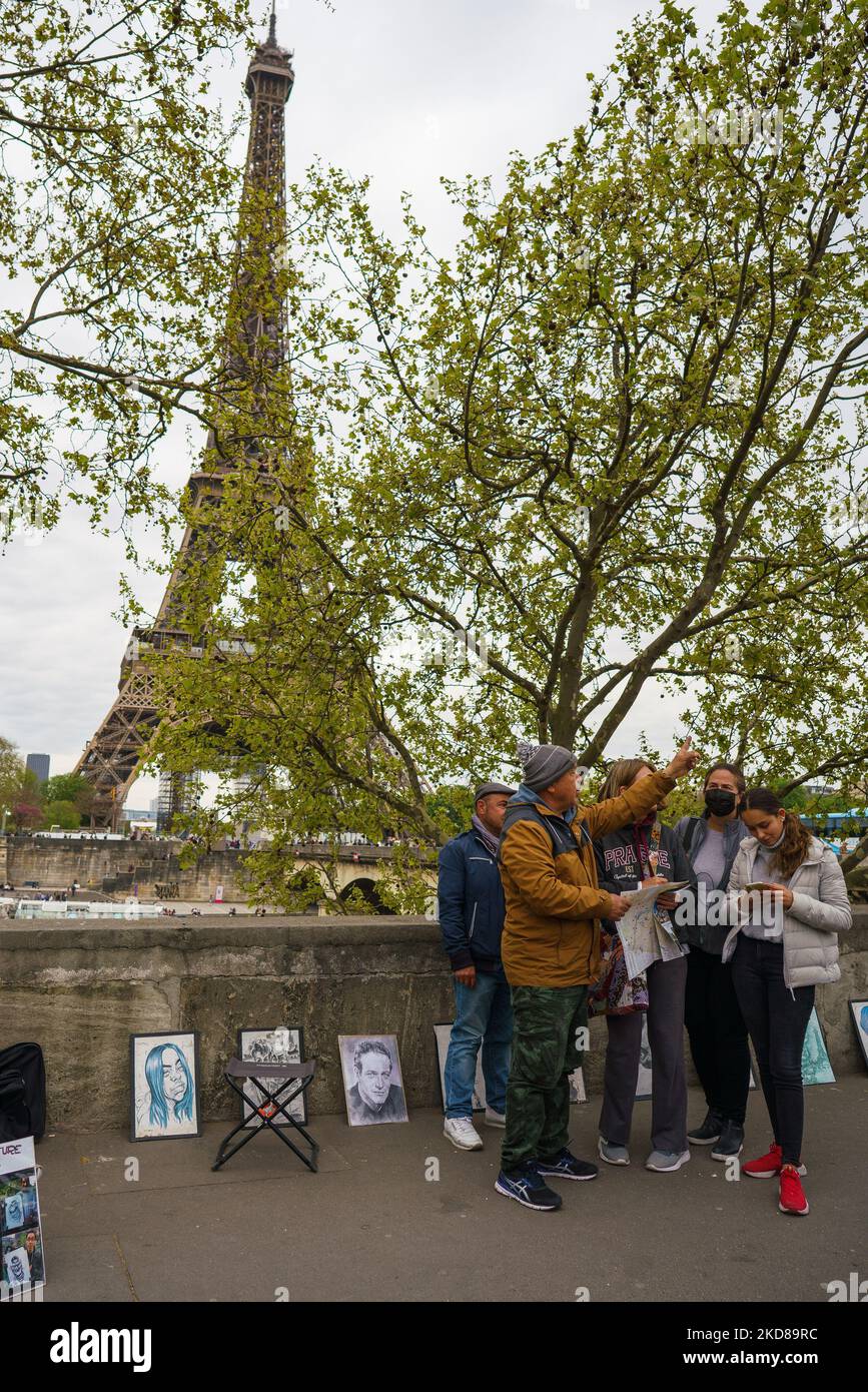 Tourists visit at the Eiffel Tower in Paris, France, on April 23, 2022 ...