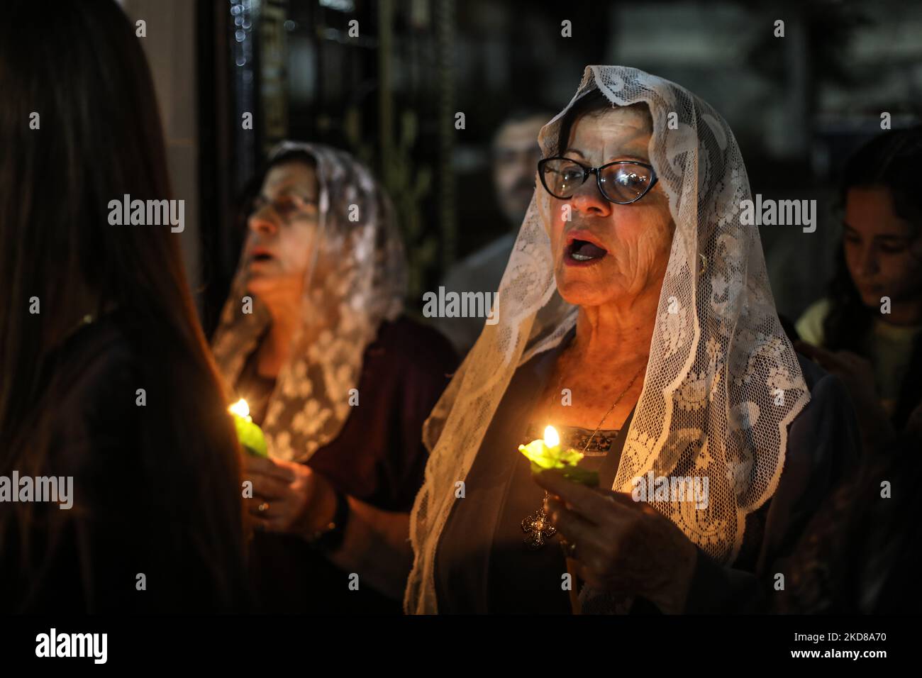 Palestinian Christians attend an Orthodox service during Easter night ...