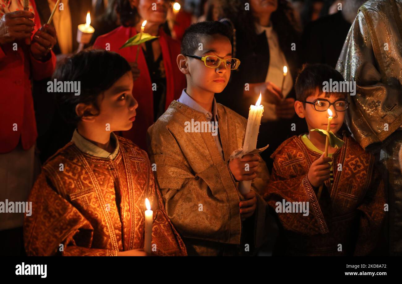 Palestinian Christians attend an Orthodox service during Easter night ...