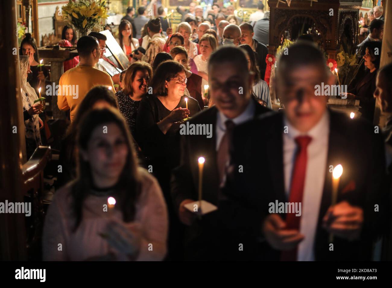 Palestinian Christians attend an Orthodox service during Easter night ...