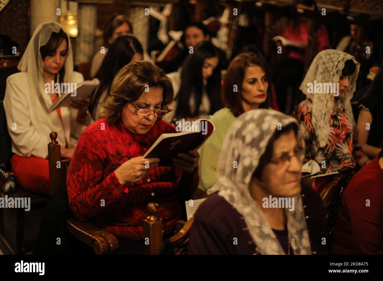 Palestinian Christians attend an Orthodox service during Easter night ...