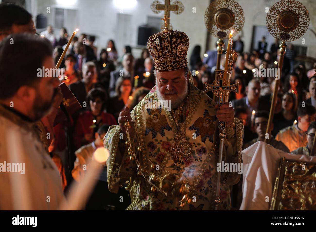 Palestinian Christians attend an Orthodox service during Easter night ...