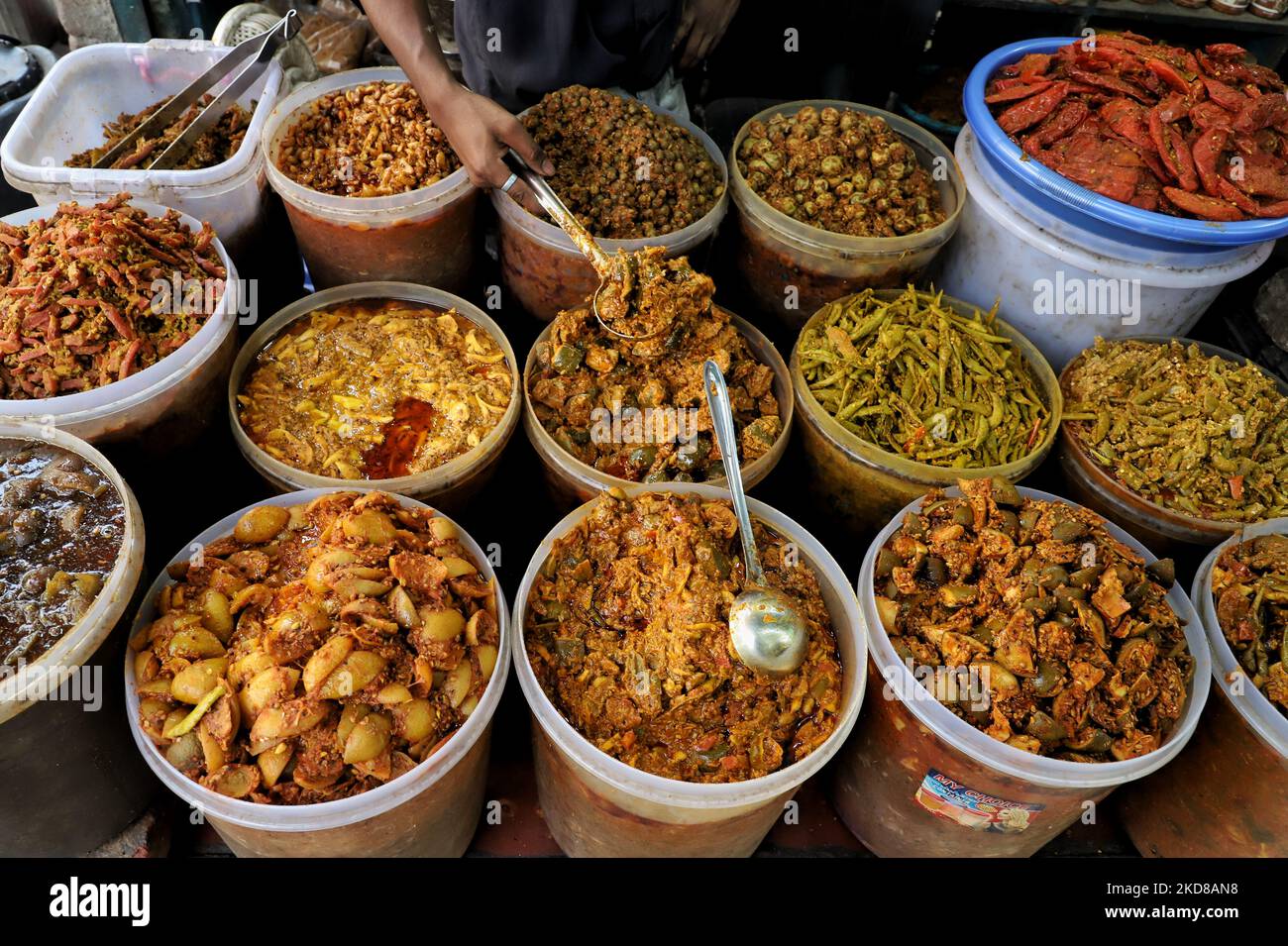 A shopkeeper sellings variety of Pickles Like Chilly, Lemon, Mango, and ...