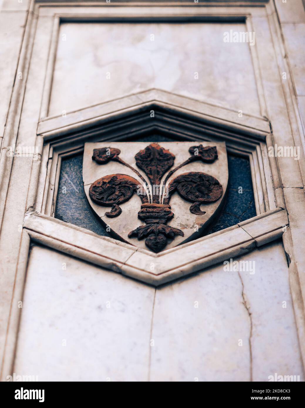 A vertical shot of marble relief of The Symbol of Florence Stock Photo ...